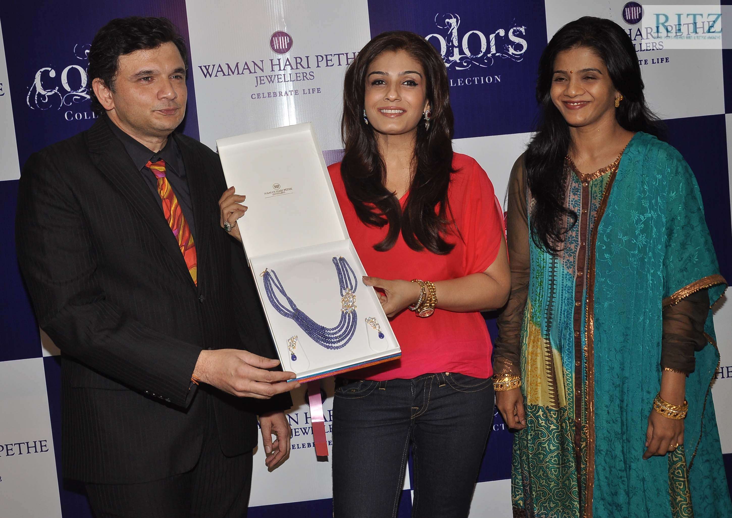 Mr. Aditya Pethe & Mrs. Sonali Pethe with Raveena Tandon while ...