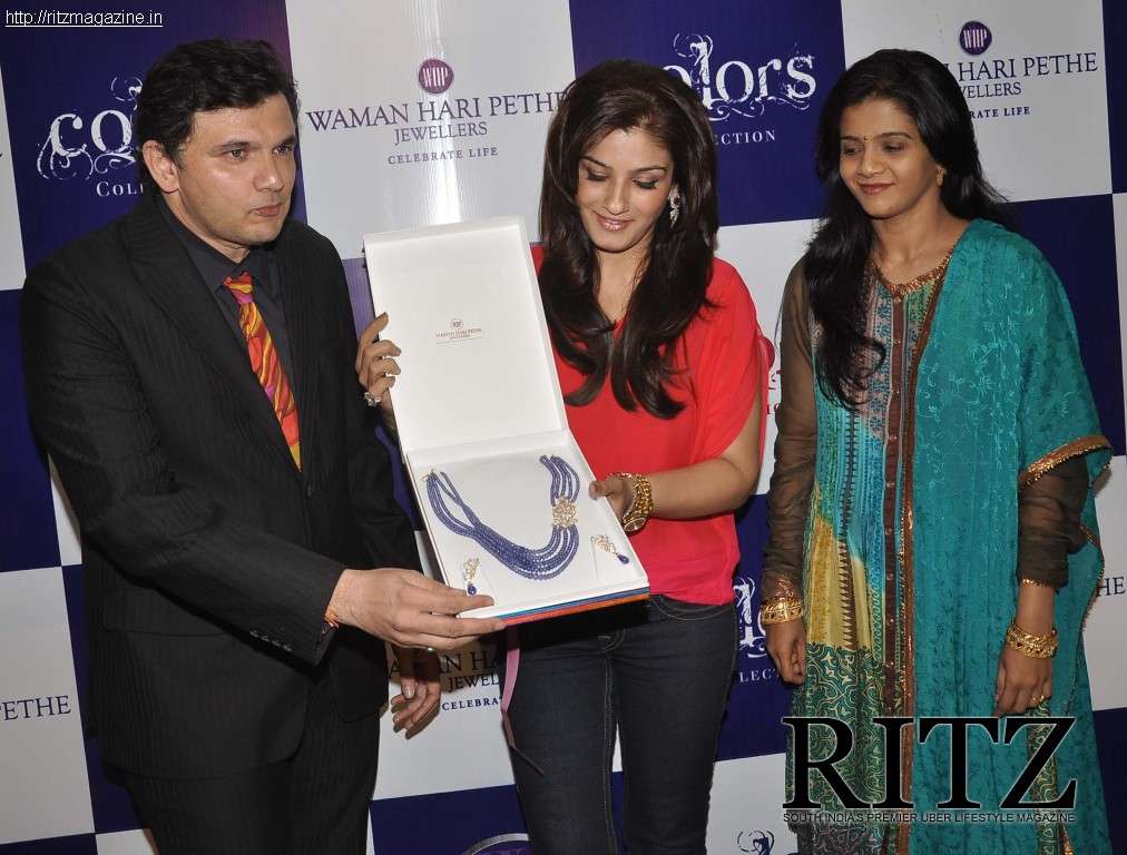 Mr. Aditya Pethe & Mrs. Sonali Pethe with Raveena Tandon while ...